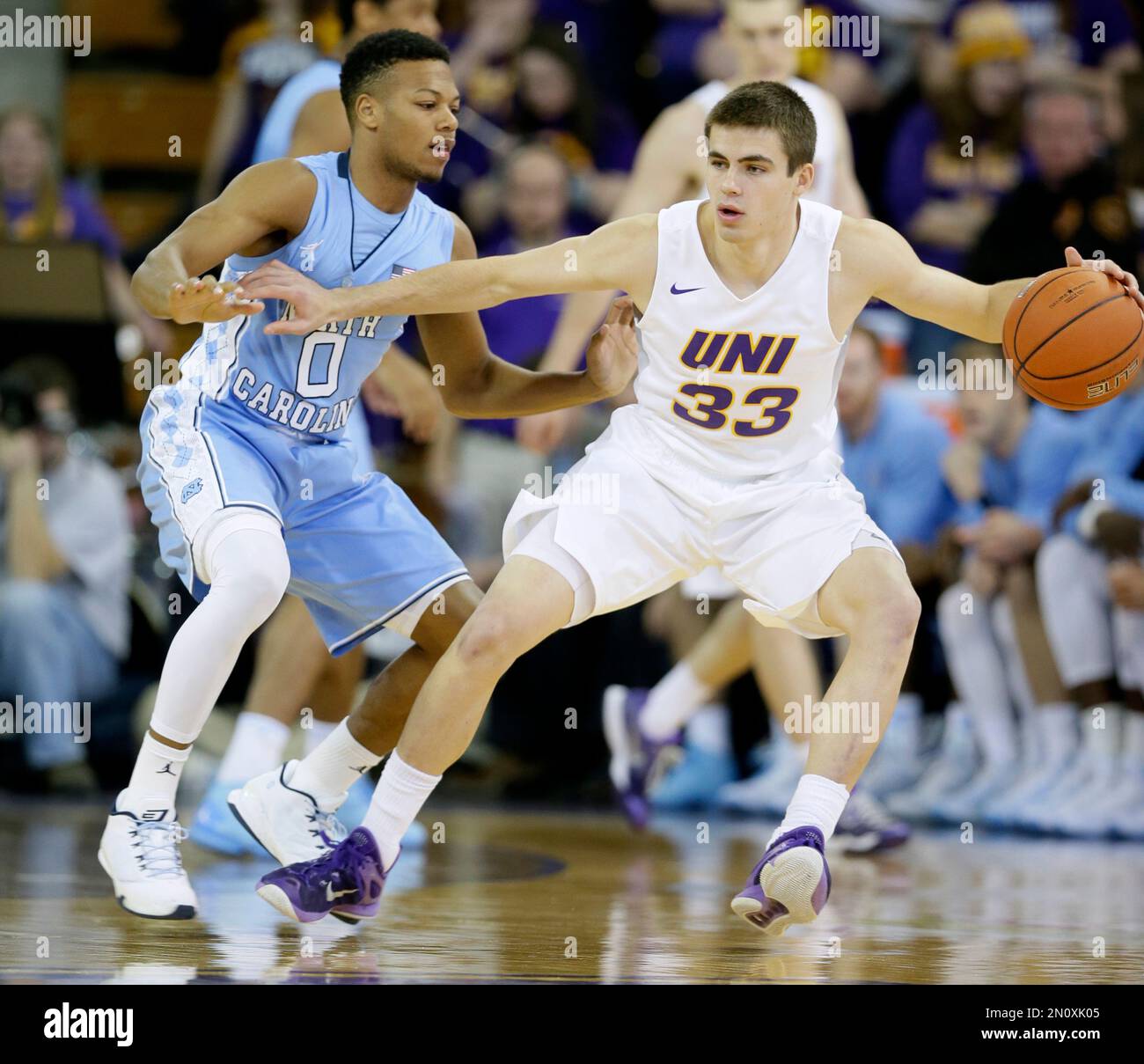 Northern Iowa guard Wyatt Lohaus, right, tries to drive around North ...