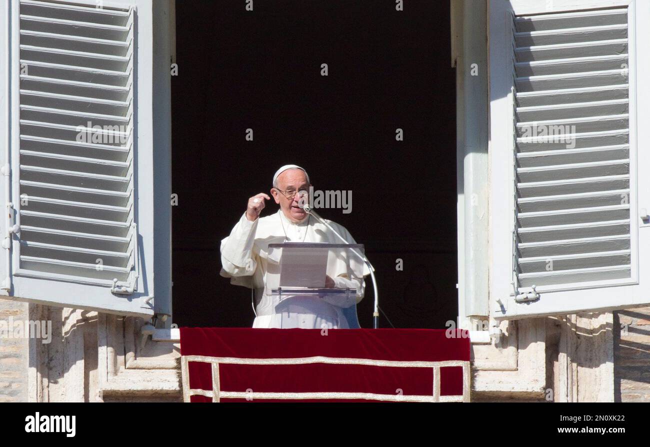 Pope Francis delivers the Angelus noon prayer from his studio window ...