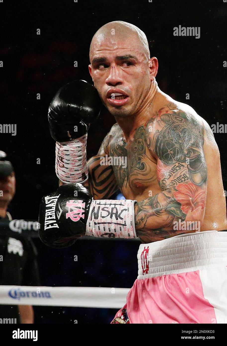 Miguel Cotto, of Puerto Rico, fights Canelo Alvarez, of Mexico, during a WBC middleweight title ...