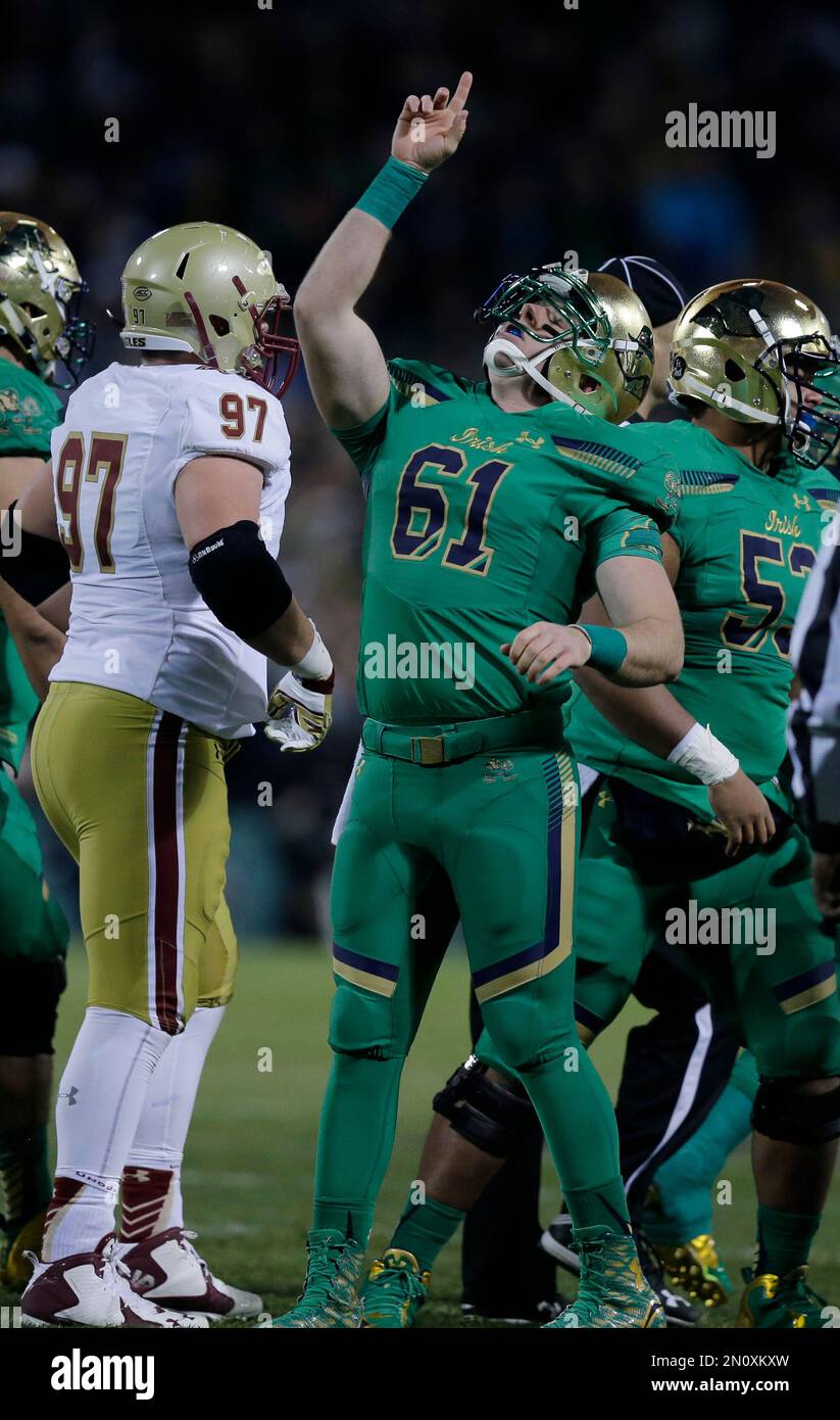 Notre Dame long snapper Scott Daly (61) points upward during the first ...