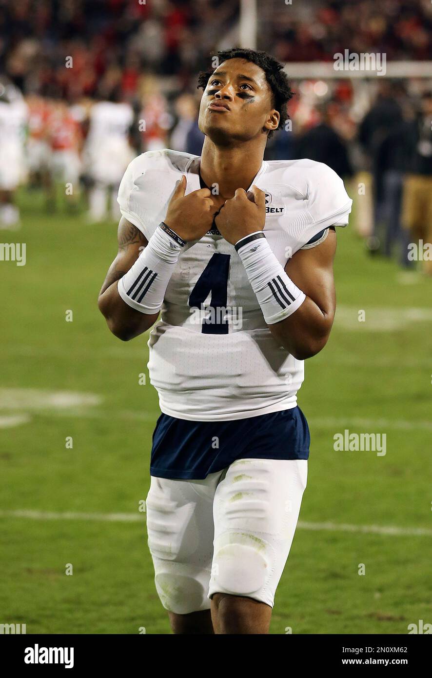 Georgia Southern quarterback Kevin Ellison (4) walks off the field ...