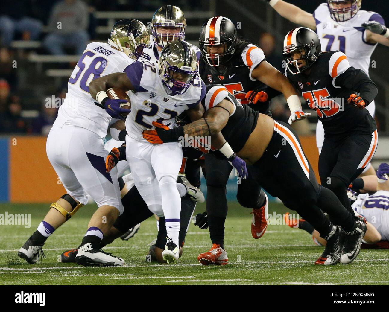Washington's Lavon Coleman tries to break through the Oregon State ...