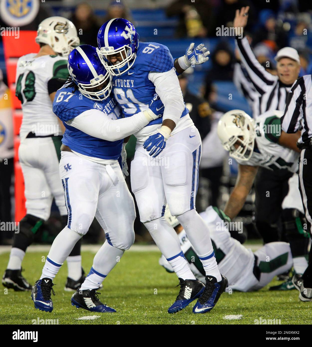Kentucky defensive tackle Cory Johnson, left, congratulates defensive ...