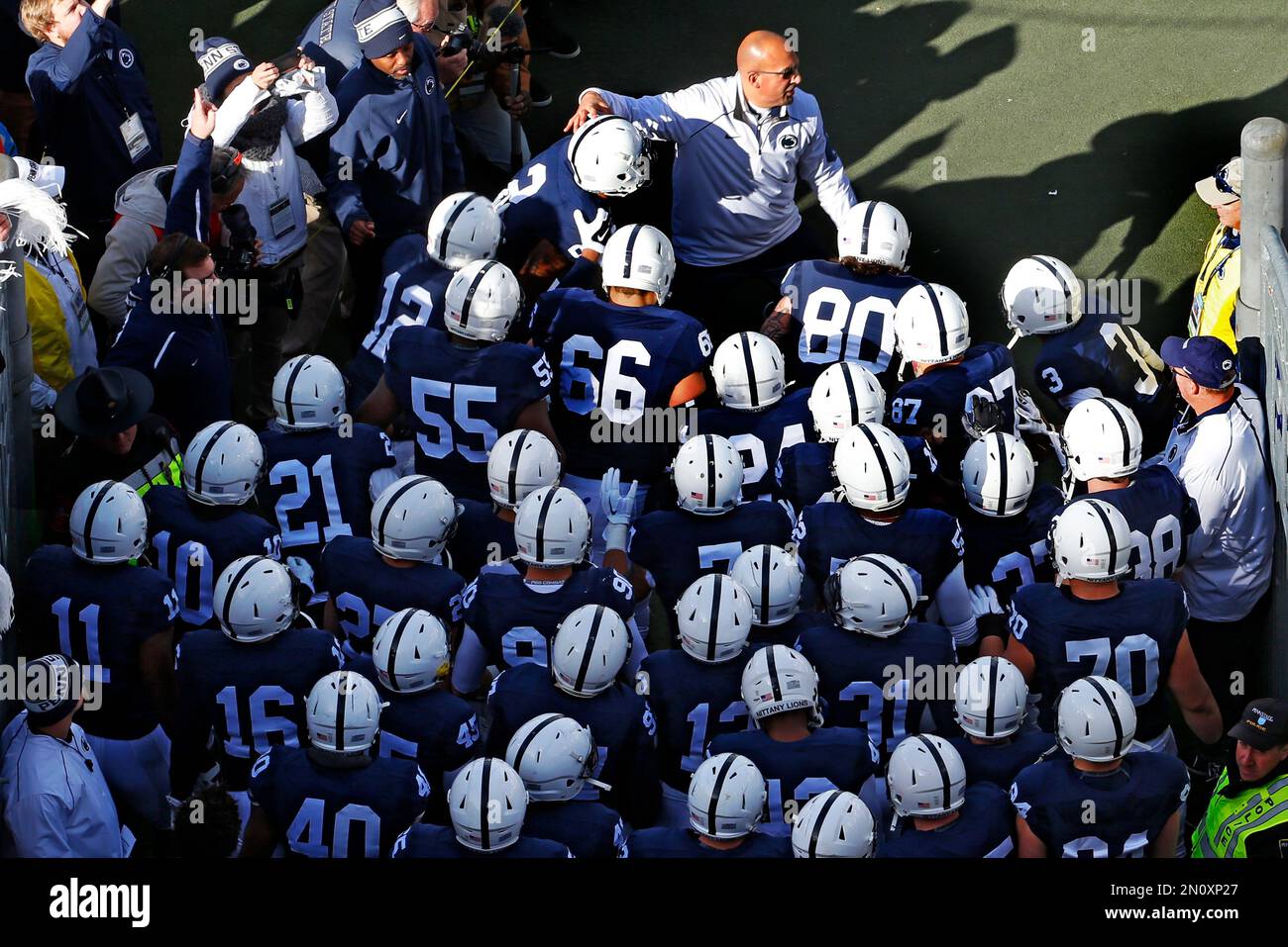 Penn State head coach James Franklin, top center, leads his team onto ...
