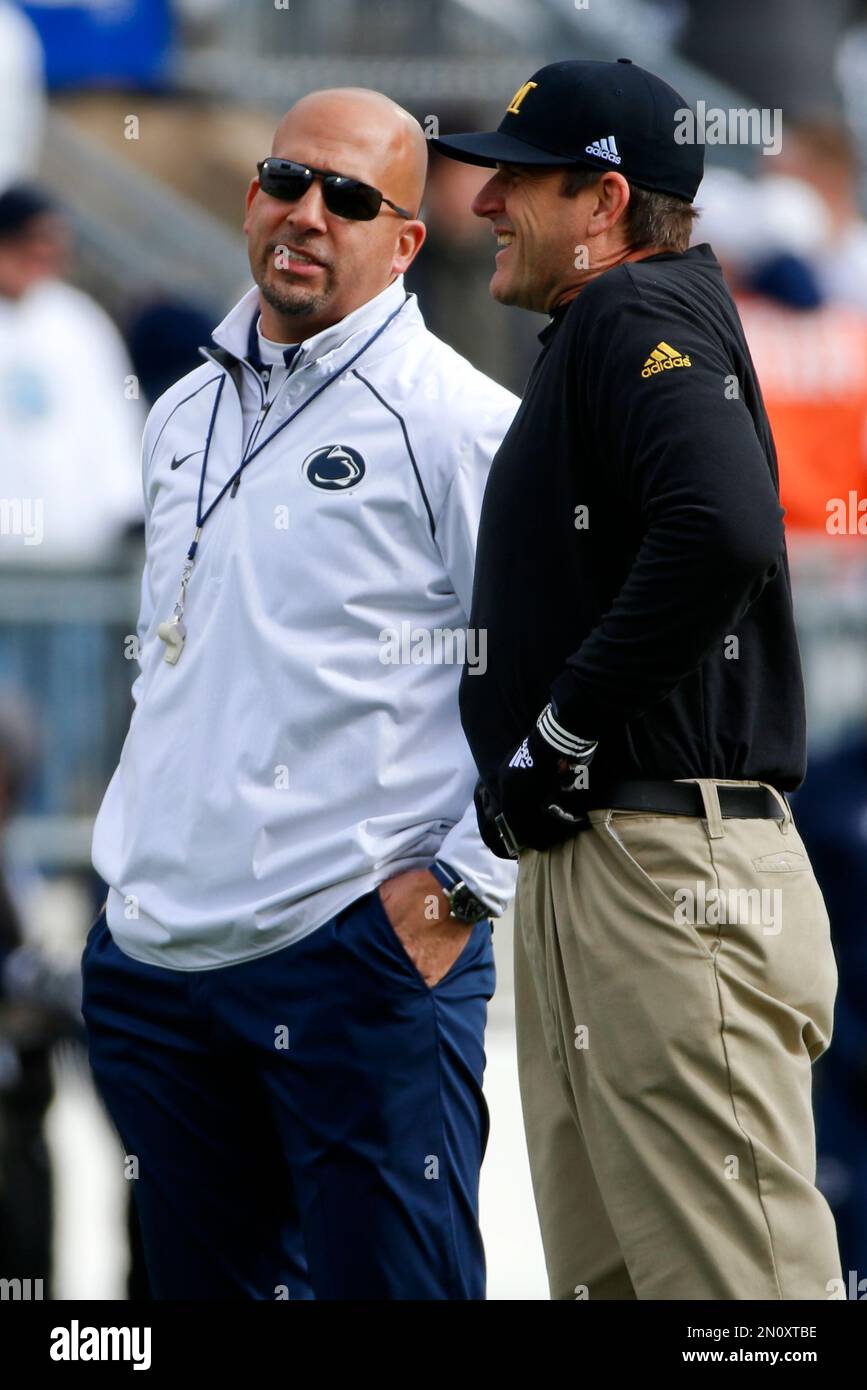 Michigan head coach Jim Harbaugh, right visits with Penn State head ...