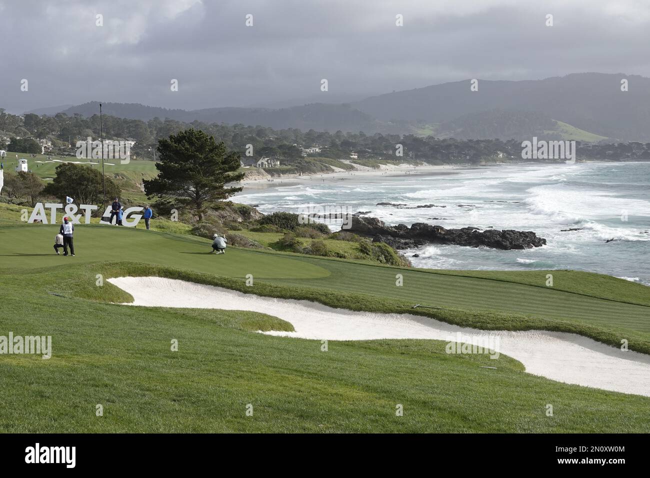 Pebble Beach, CA, USA. 5th Feb, 2023. Players walk in front of sparse ...