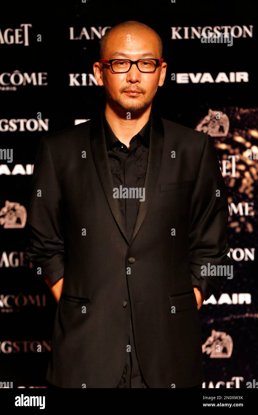 Chinese director Guan Hu poses on the red carpet at the 52nd Golden ...