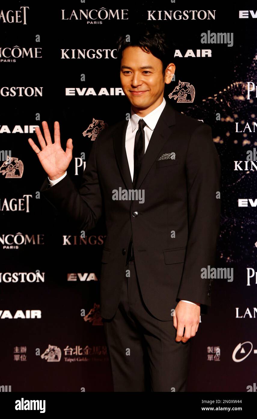 Japanese actor Tsumabuki Satoshi poses on the red carpet at the 52nd ...