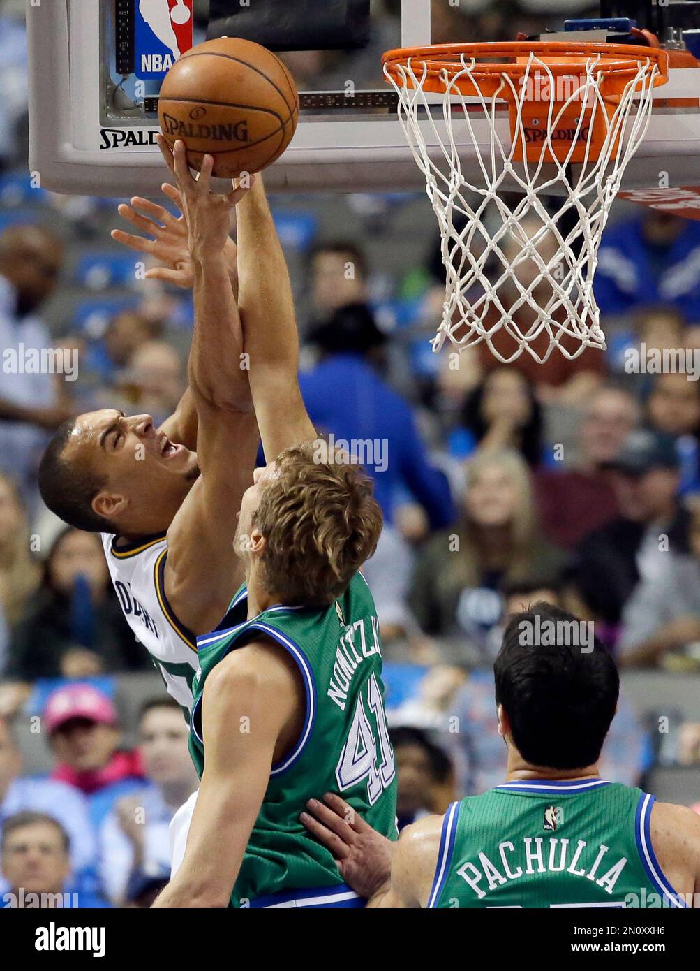 Utah Jazz center Rudy Gobert, left, drives to the basket against Dallas ...