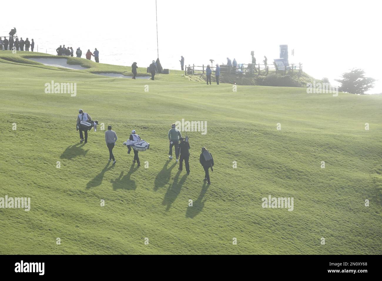 Pebble Beach, CA, USA. 5th Feb, 2023. Players climb the steep slope up ...
