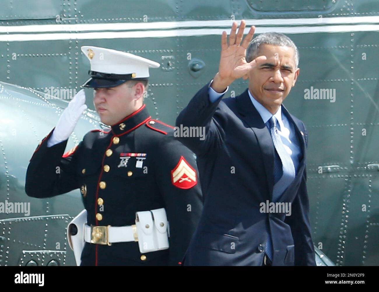 U.S. President Barack Obama waves as he exits Marine One at the Ninoy ...