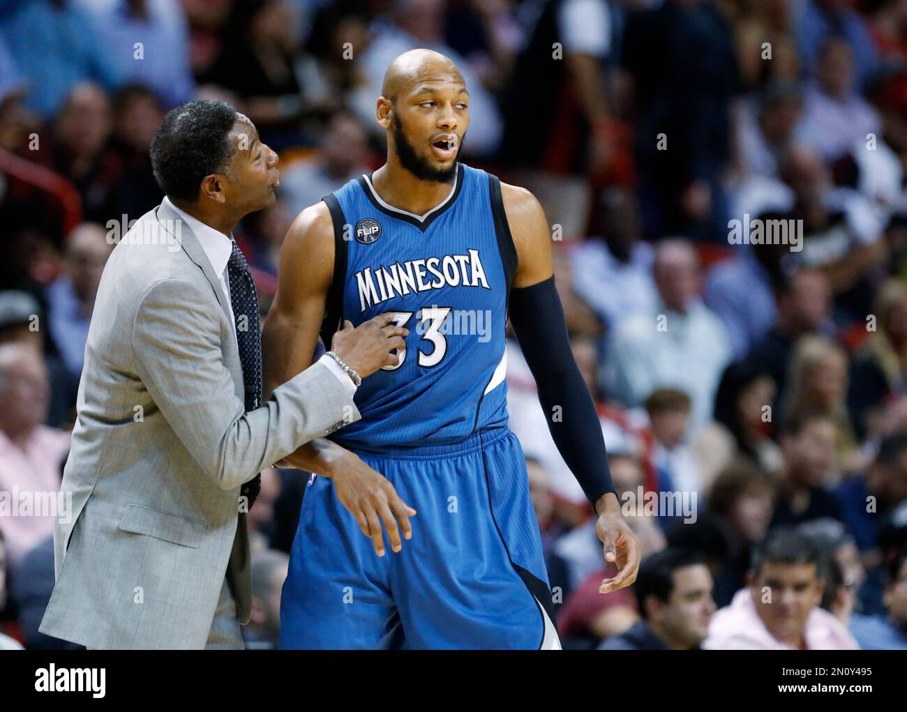 Minnesota Timberwolves head coach Sam Mitchell talks to forward Adreian ...