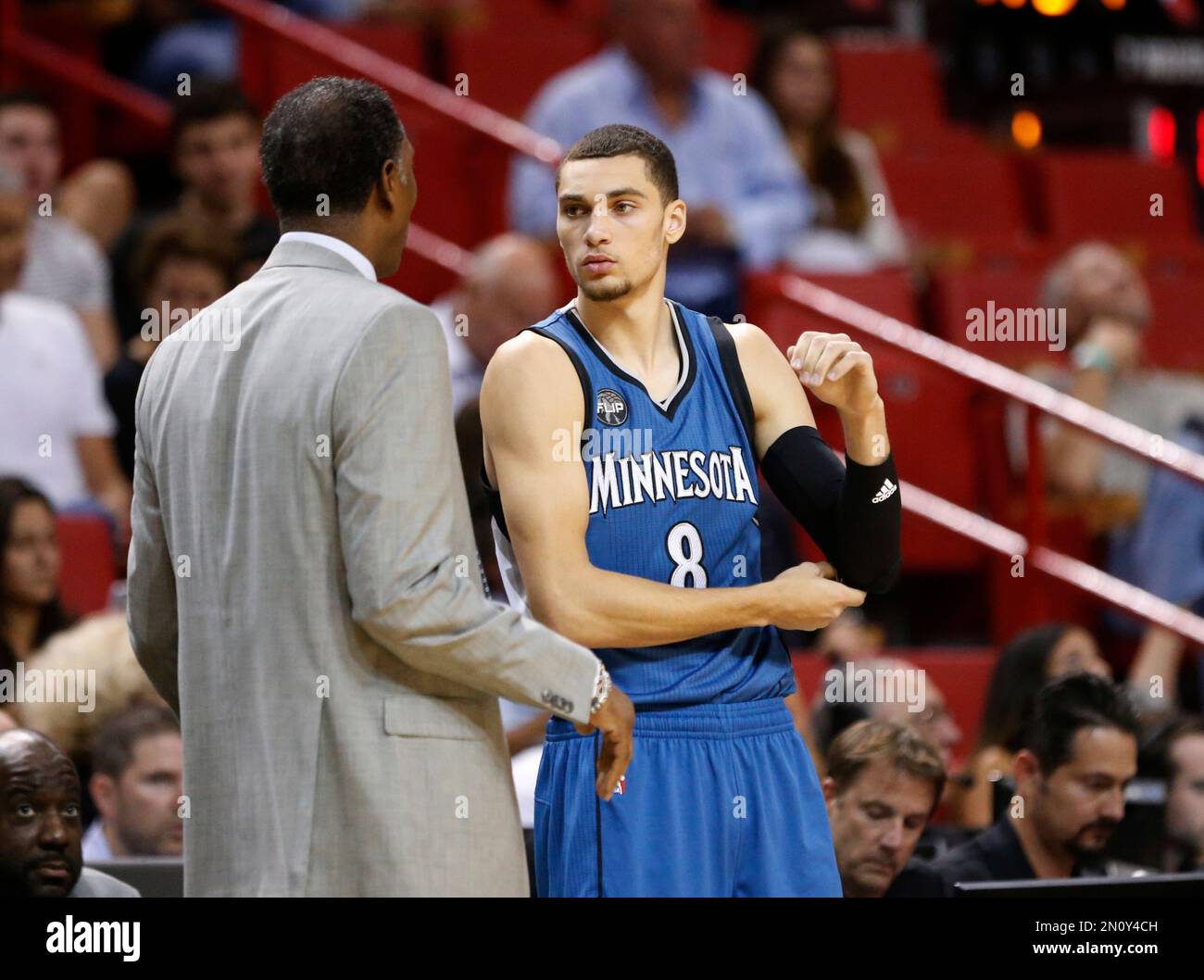 Minnesota Timberwolves head coach Sam Mitchell talks with guard Zach ...