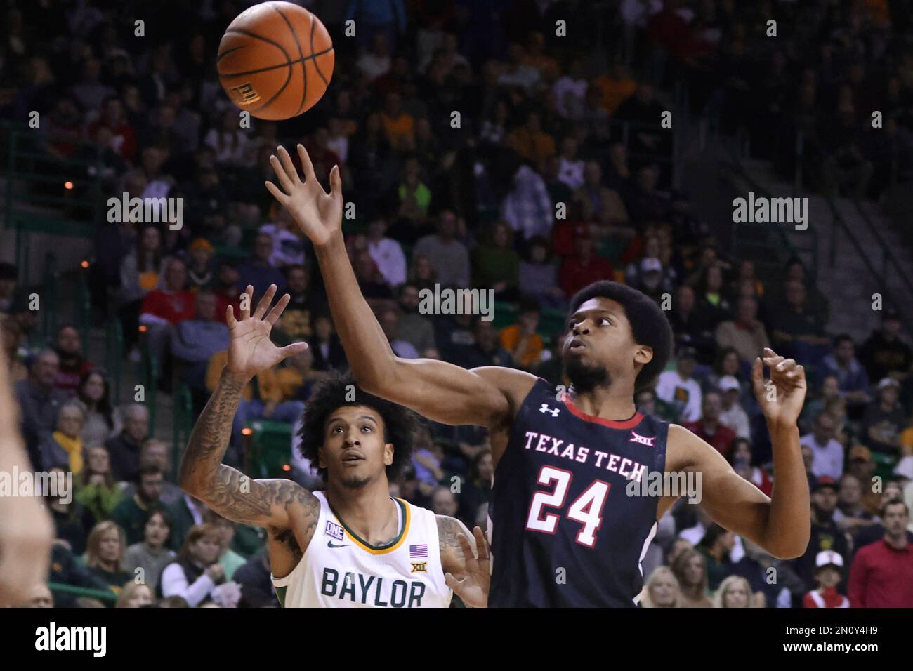 Texas Tech guard Kerwin Walton (24) reaches for a rebound over Baylor ...