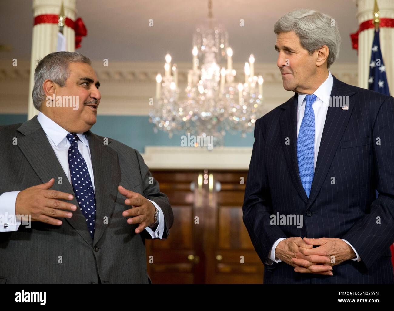 Secretary of State John Kerry looks at Bahrain's Foreign Minister ...