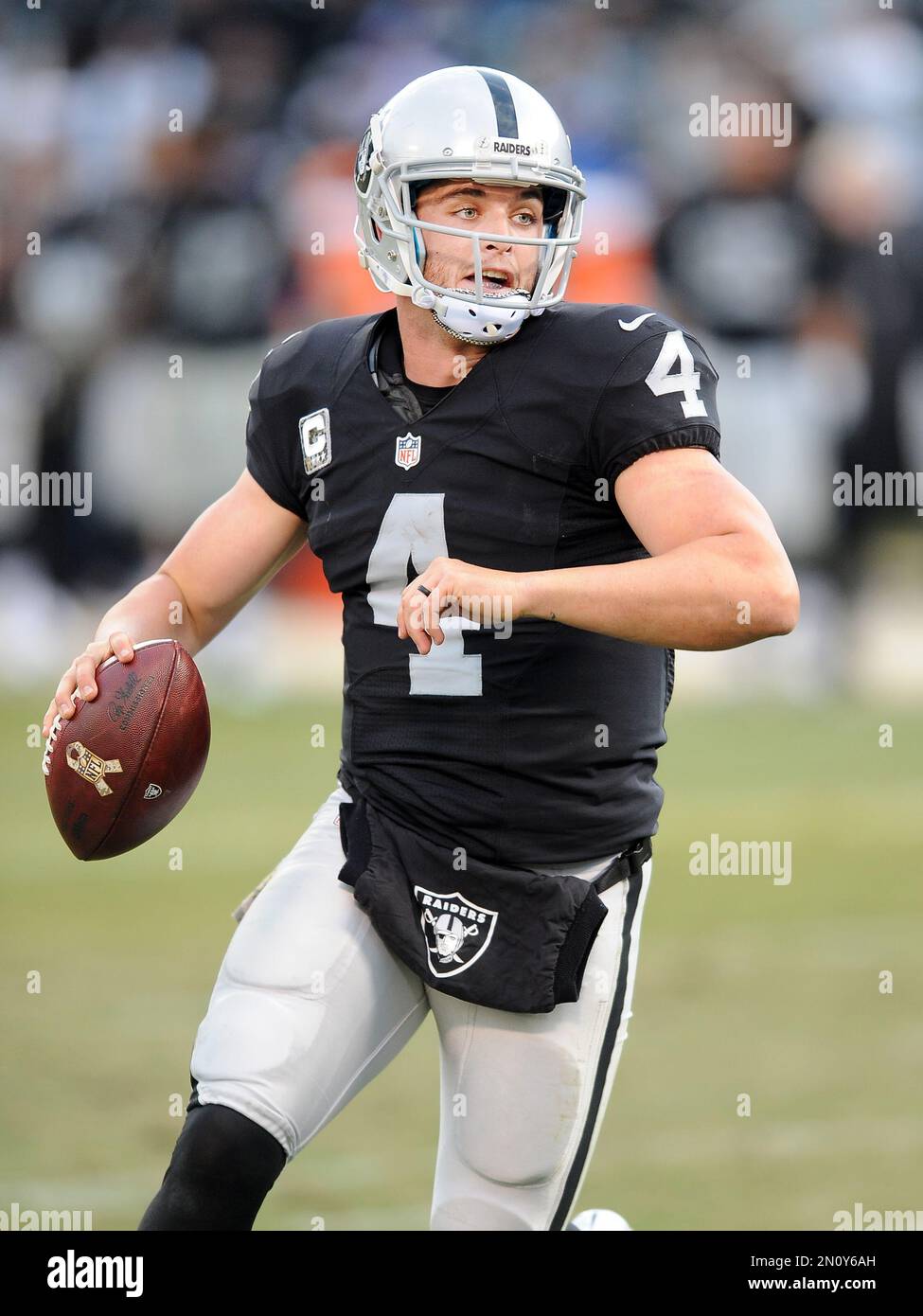 Oakland Raiders quarterback (4) Derek Carr on the run during a game against the Minnesota ...
