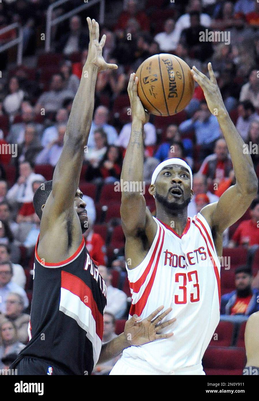 Houston Rockets' Corey Brewer (33) shoots under pressure from Portland ...