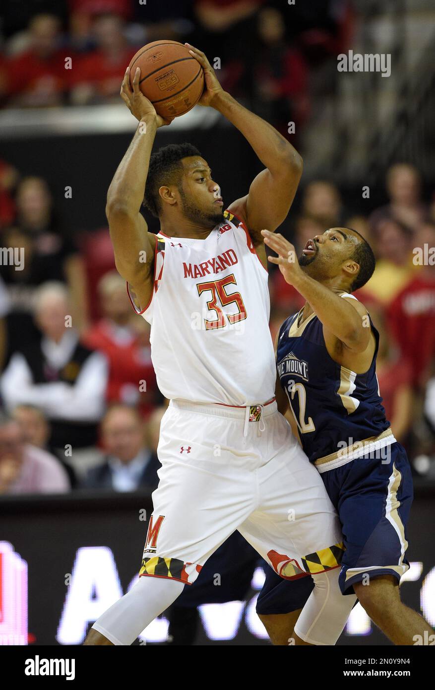Maryland forward Damonte Dodd (35) works the ball against Mount St ...