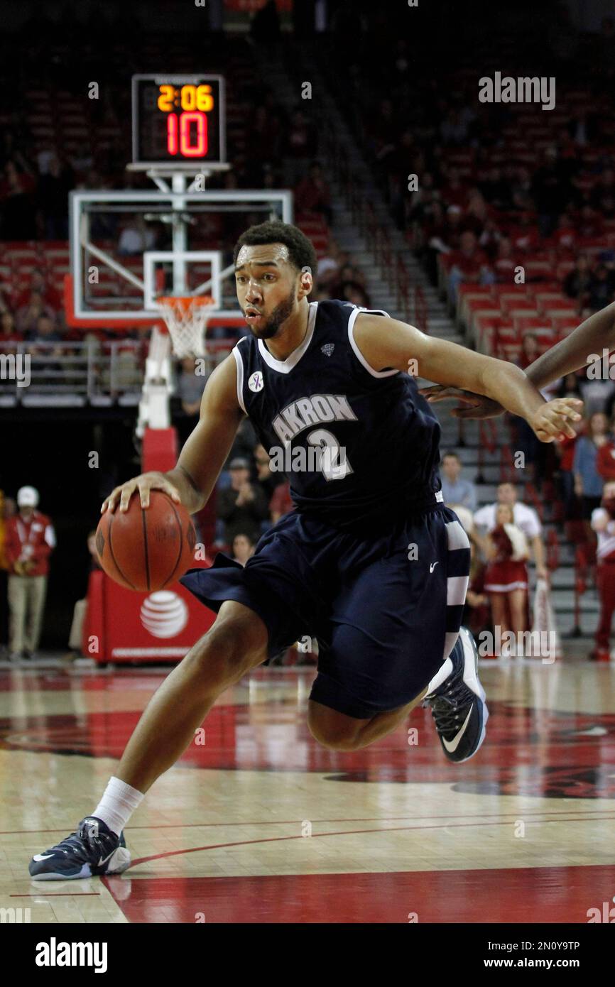 Akron's Kwan Cheatham Jr. (2) drives into the key during the second ...