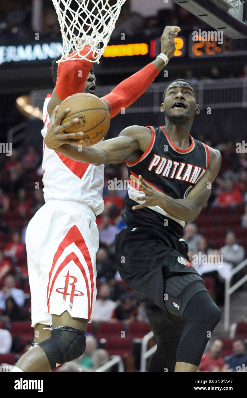 Portland Trail Blazers' Maurice Harkless, right, goes to the basket ...
