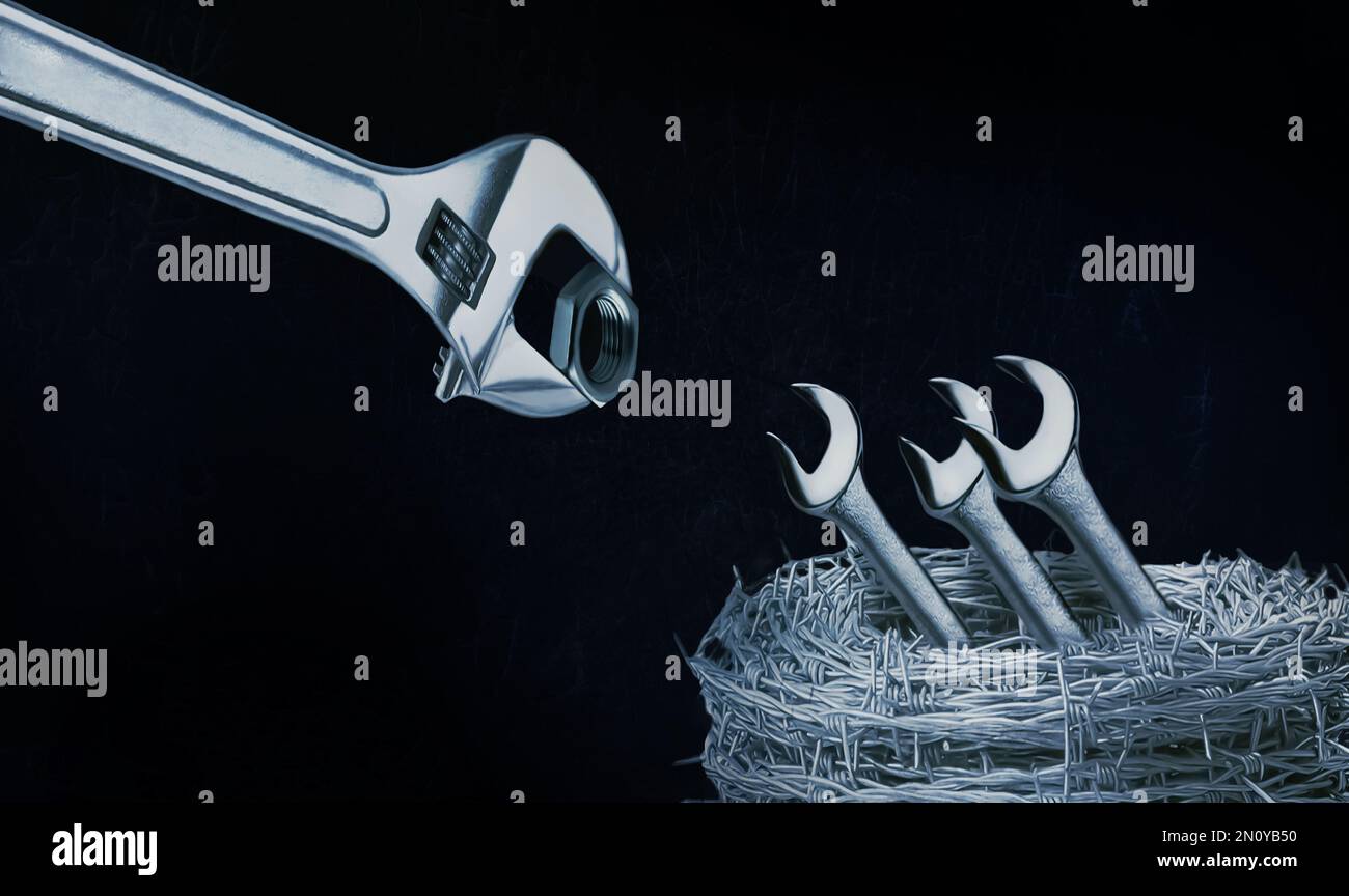 metal locksmith wrenches and nuts with barbed wire Stock Photo - Alamy