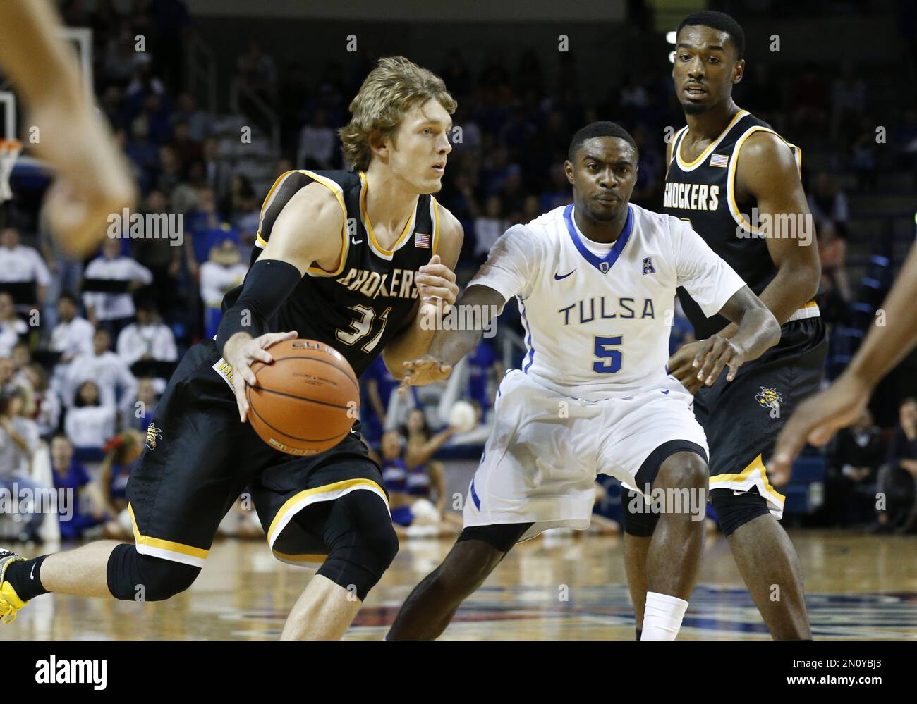Wichita State guard Ron Baker (31) drives around Tulsa guard Rashad Ray ...