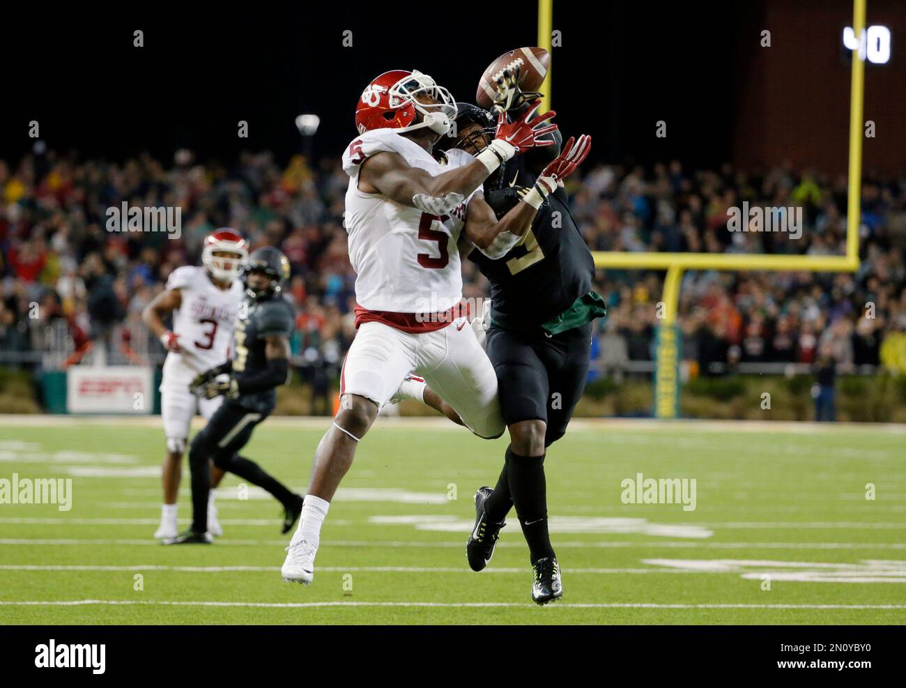 Oklahoma wide receiver Durron Neal (5) has a pass to him broken up by ...