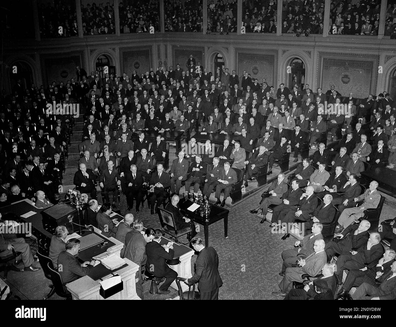 A joint session of Congress listens as President Roosevelt, seat at ...