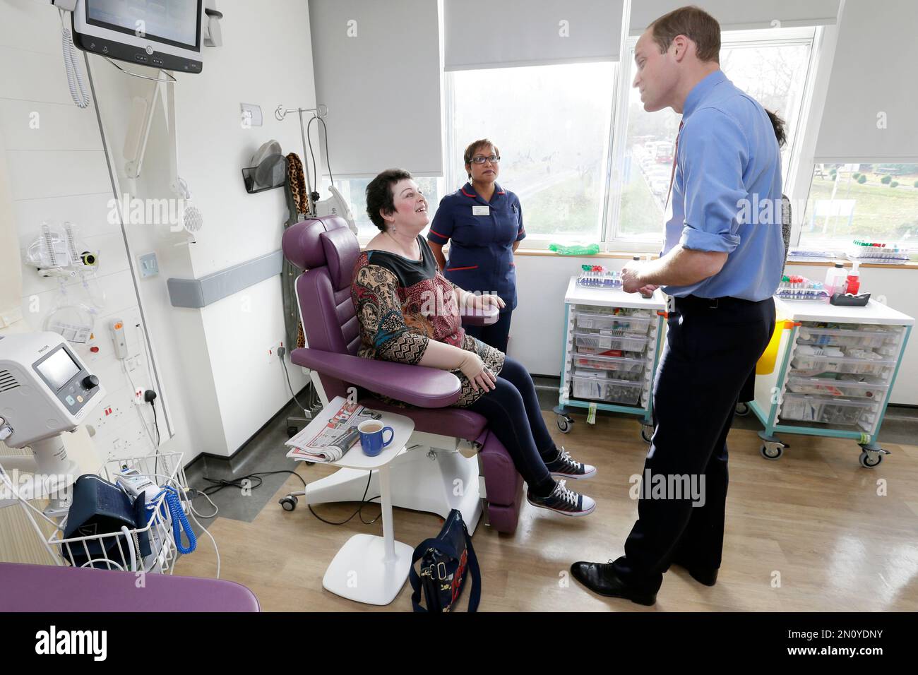 Britain's Duke of Cambridge meets patient Margaret Flannagan during a ...