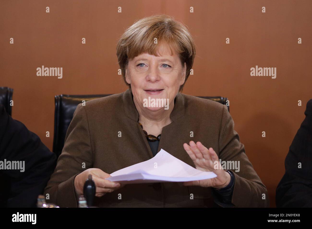 German Chancellor Angela Merkel prepares papers prior to the start of ...