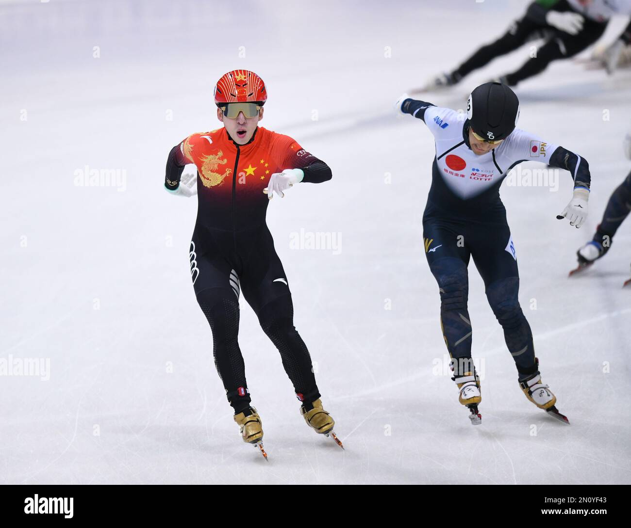 Dresden, Germany. 5th Feb, 2023. Lin Xiaojun (L) of China crosses the ...
