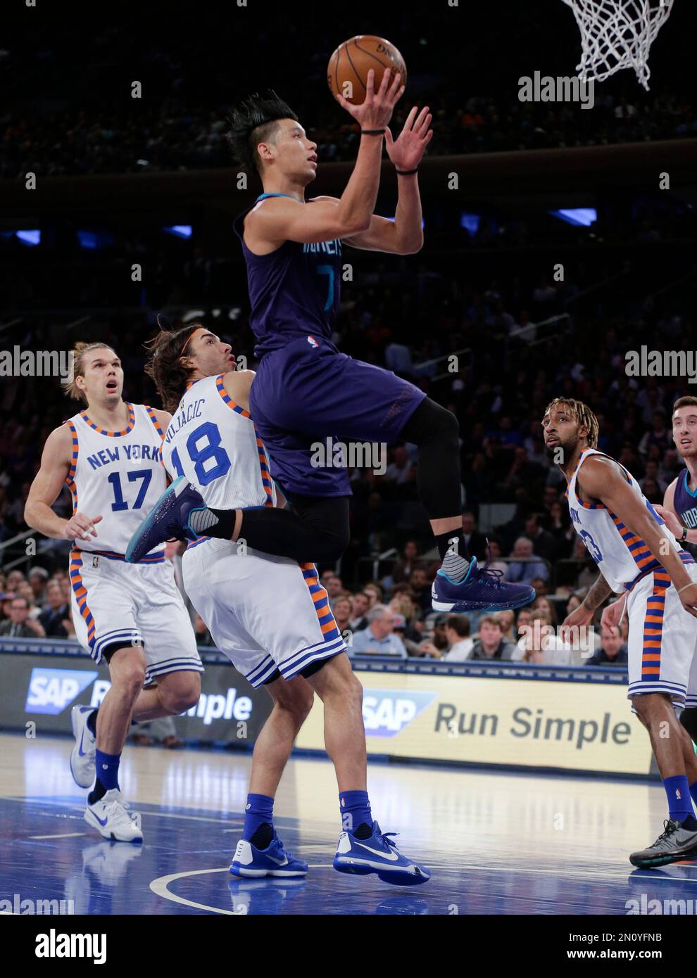 Charlotte Hornets guard Jeremy Lin (7) goes up for a shot against New ...