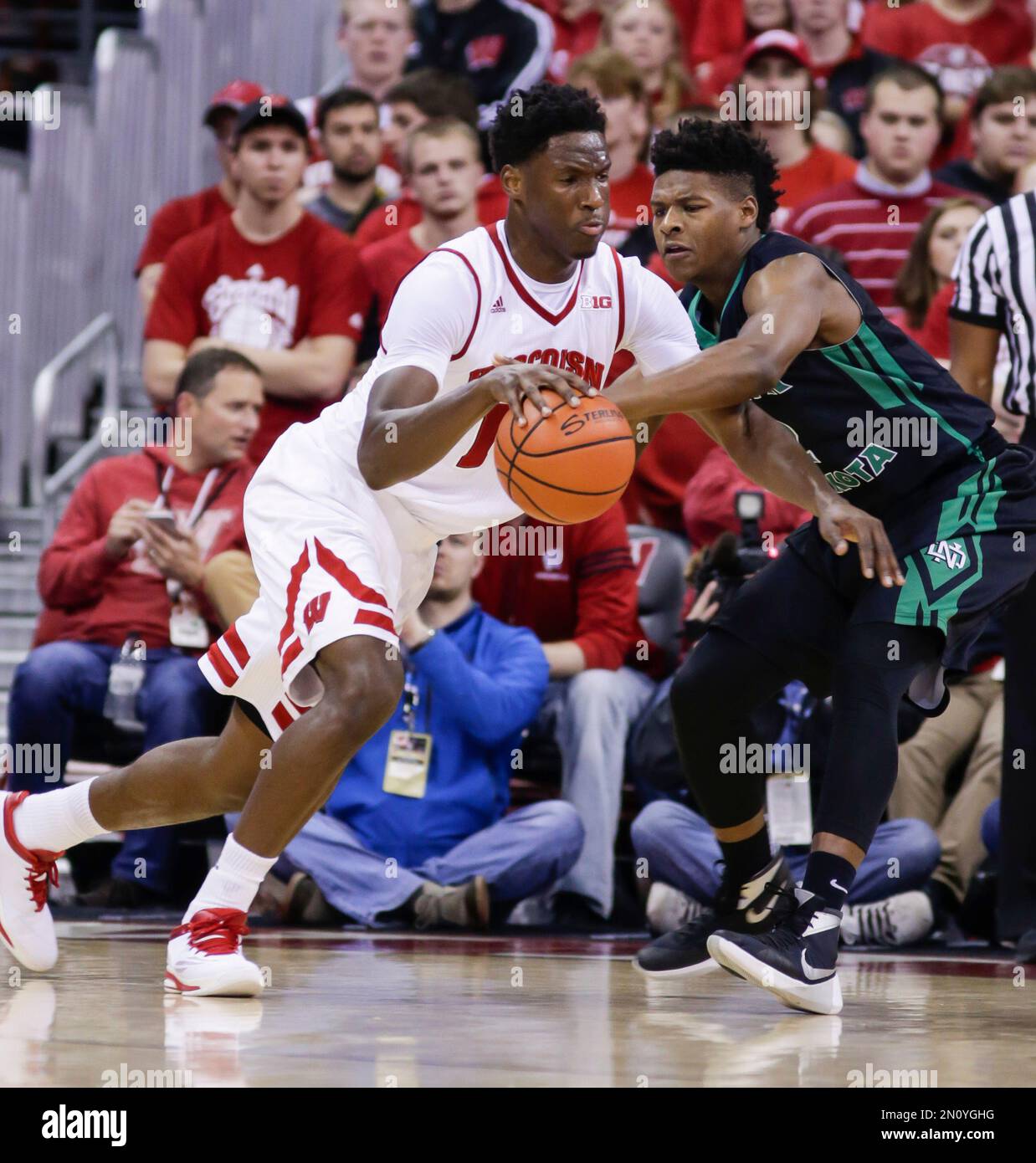 Wisconsin's Nigel Hayes, left, drives on North Dakota's Josh Collins (2 ...