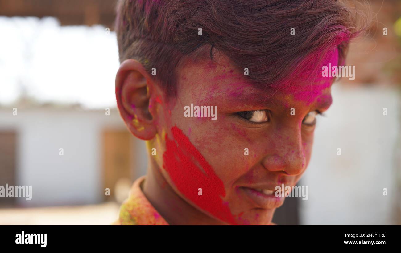 Cute indian little child playing holi. Holi is colors festival in india ...