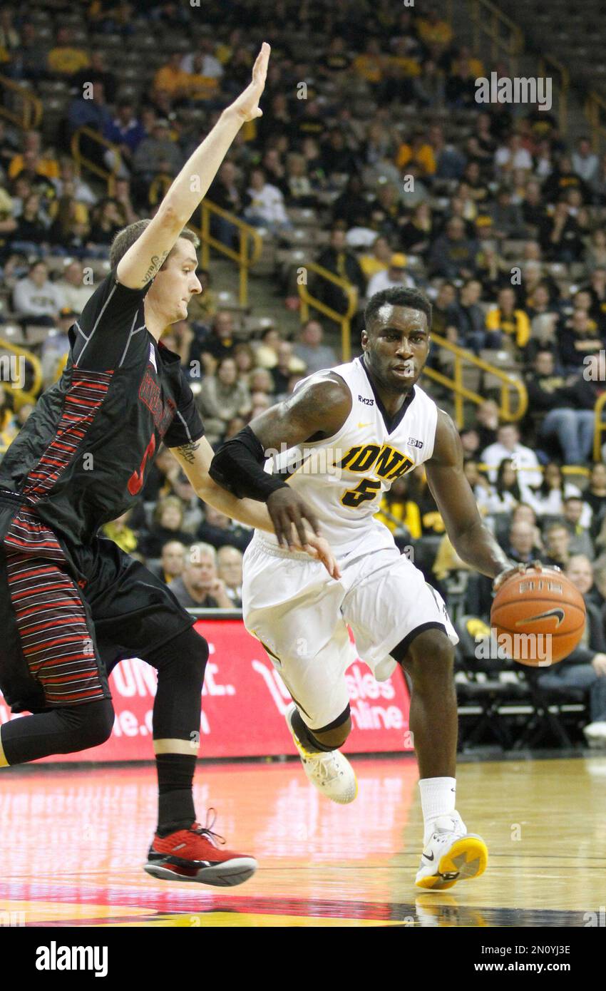 Iowa guard Anthony Clemmons (5) drives to the basket against Gardner ...