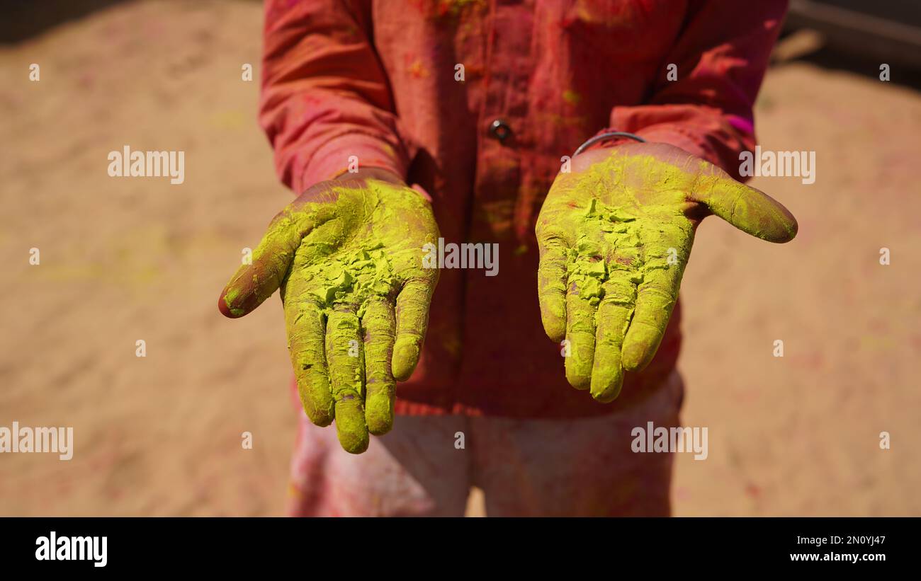 Hands or Palms of young people covered in purple, yellow, red, blue ...