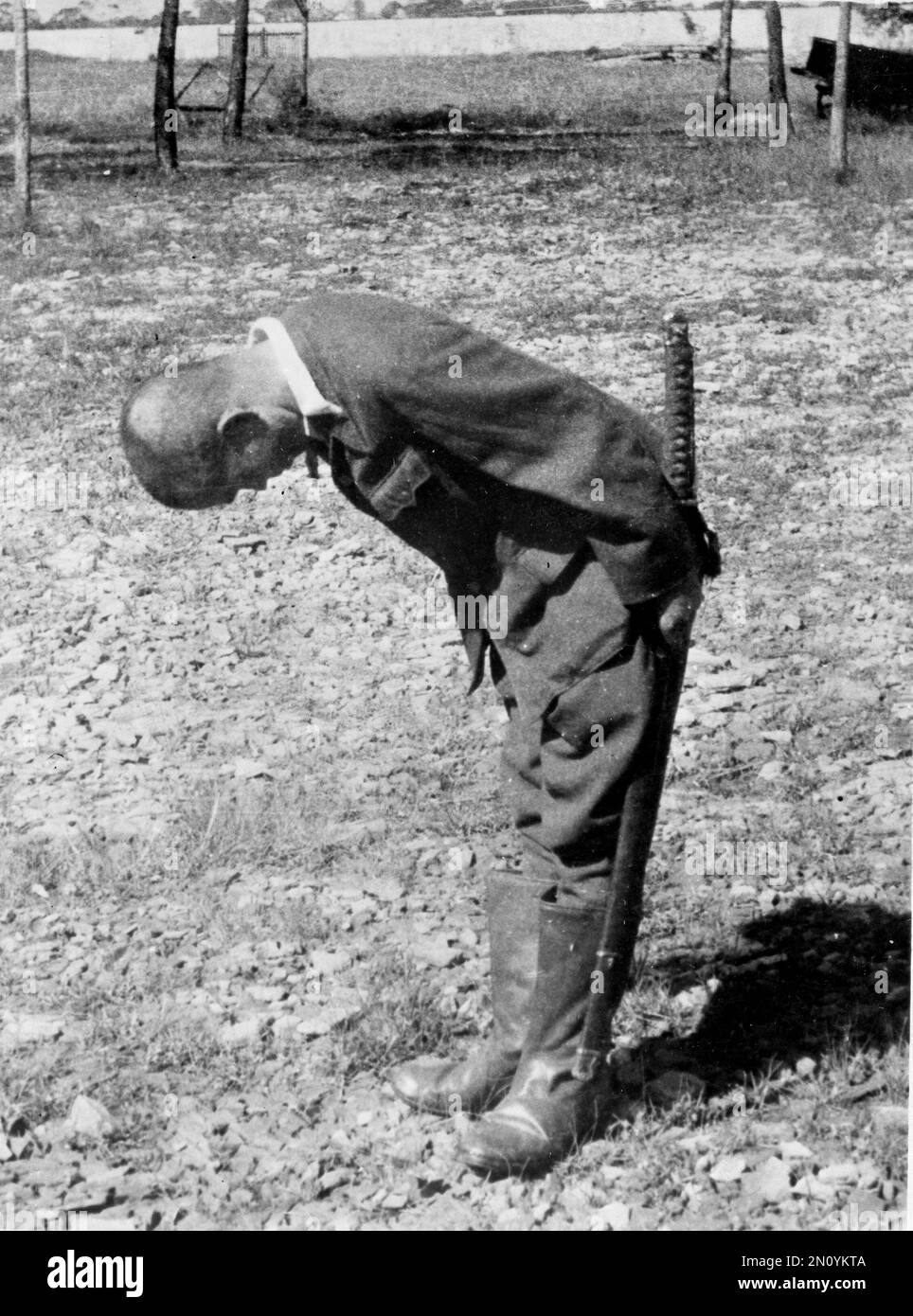 A Japanese commander bows low as he surrenders his sword in Saigon ...