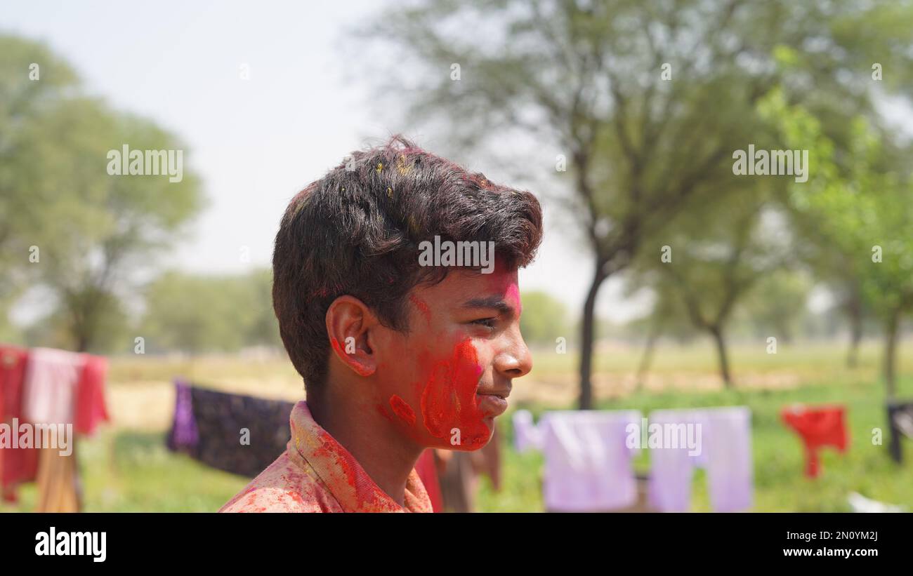 Cute indian little child playing holi. Holi is colors festival in india ...