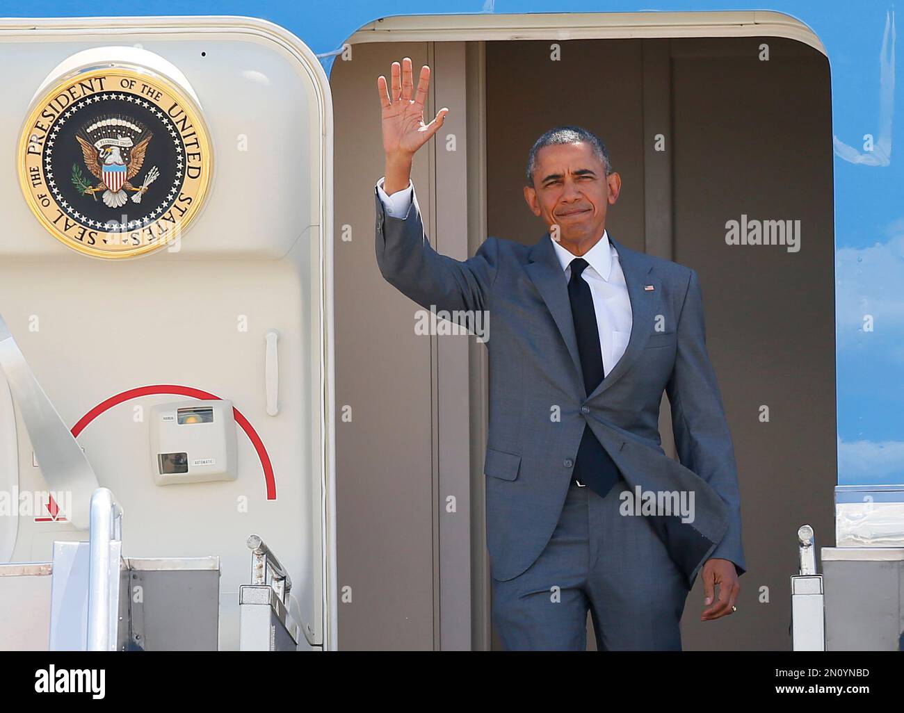 U.S. President Barack Obama waves to the media upon arrival Tuesday ...