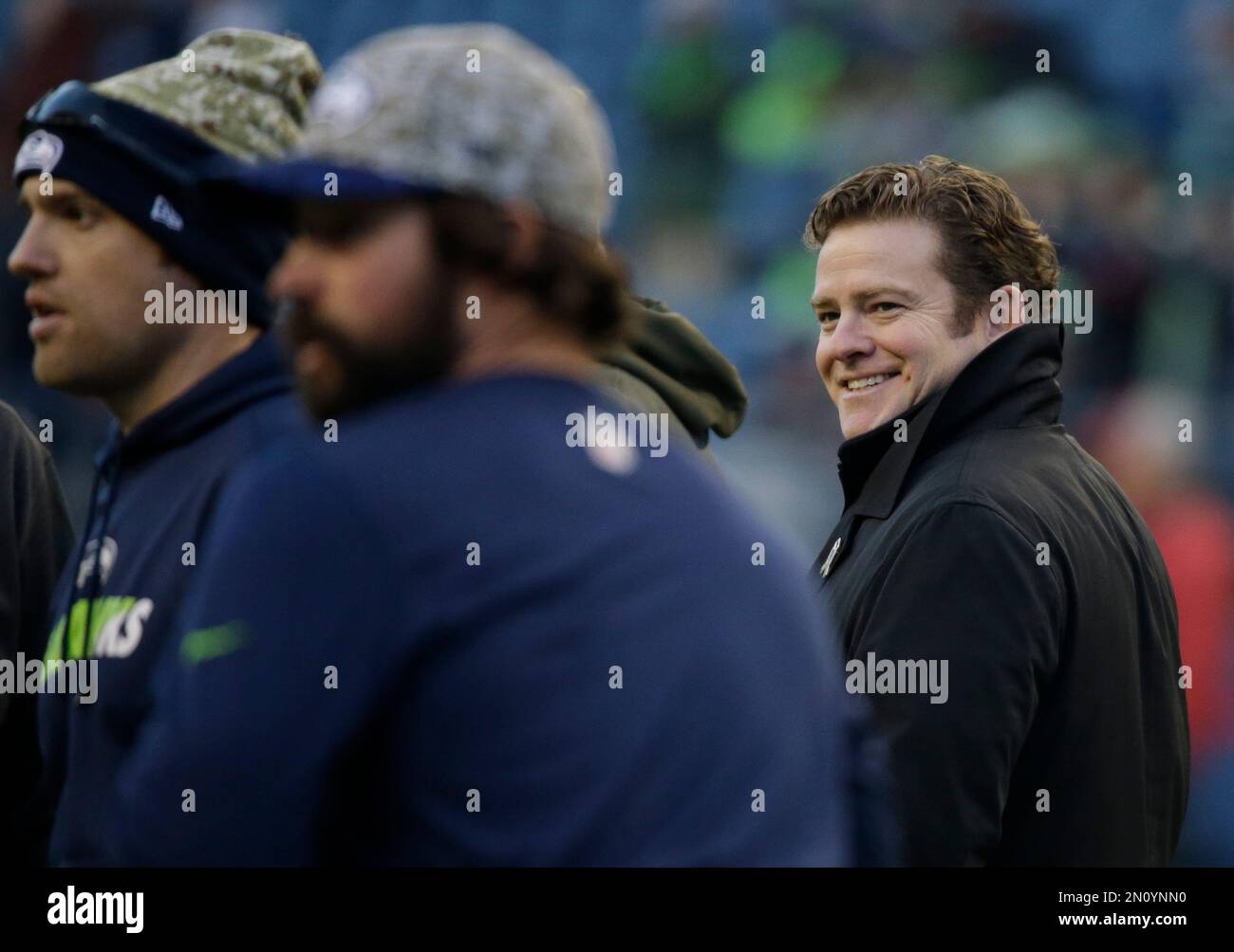 Seattle Seahawks general manager John Schneider, right, smiles during ...