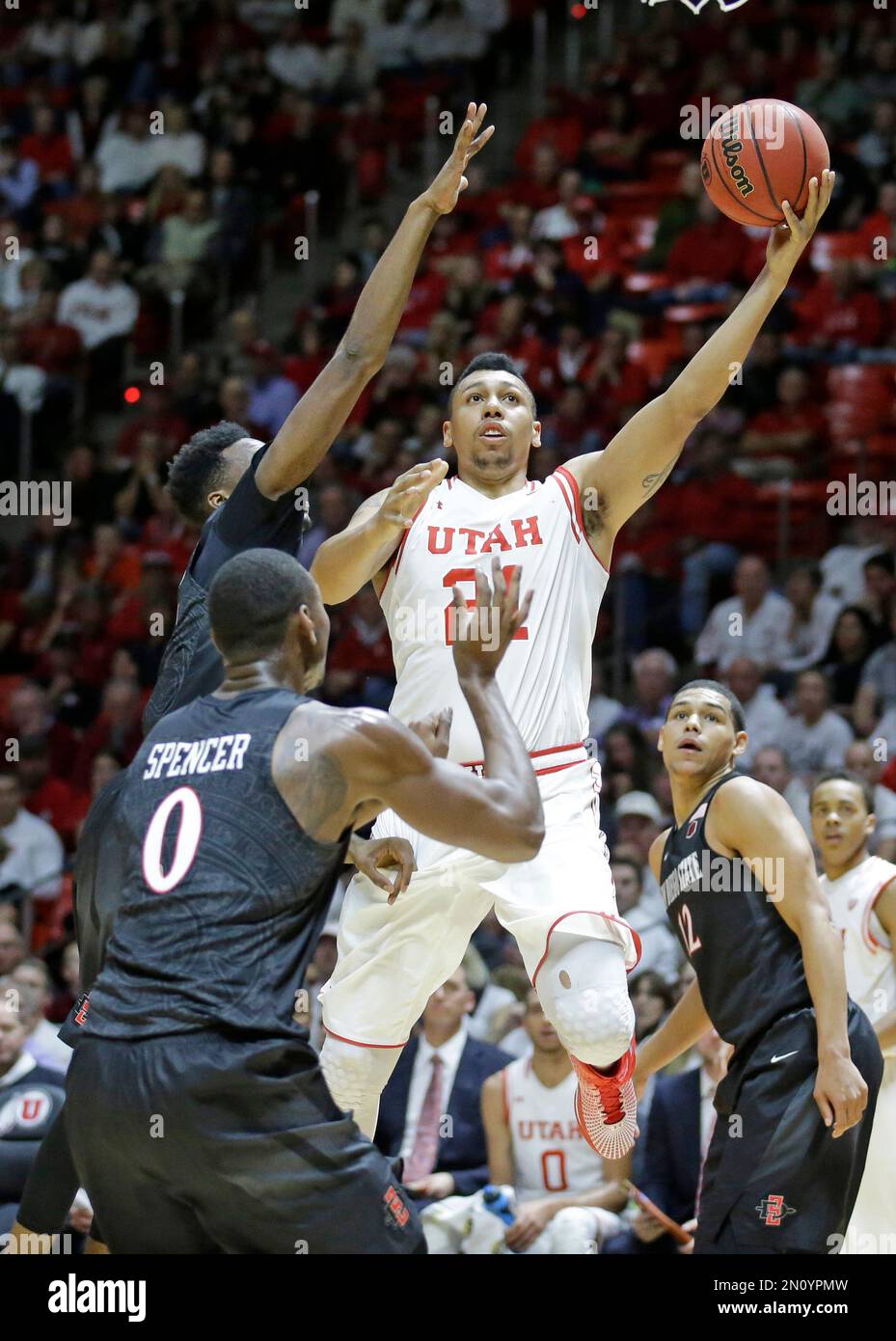 Utah forward Jordan Loveridge (21) goes to the basket as San Diego ...