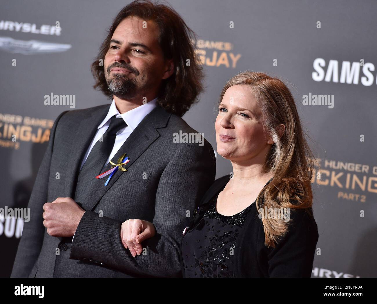 Peter Craig, left, and Suzanne Collins attend the Los Angeles premiere ...
