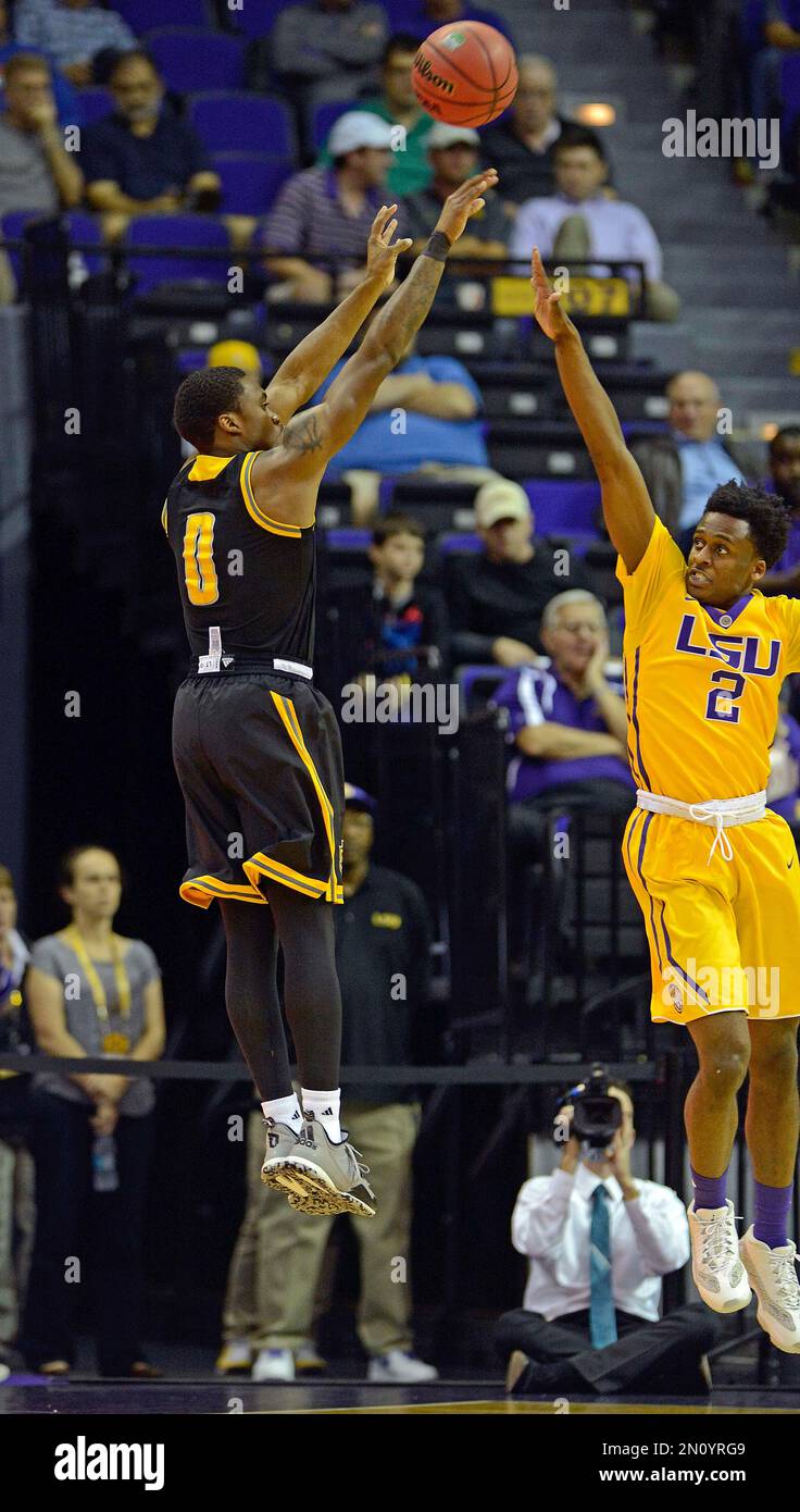 Kennesaw State guard Kendrick Ray (0) shoots a 3-pointer as LSU guard ...