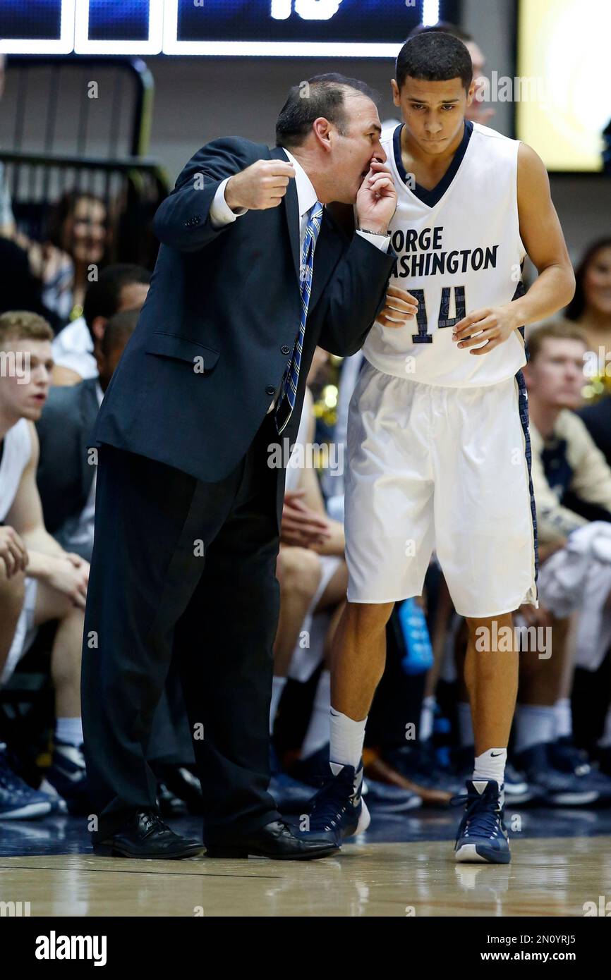 George Washington head coach Mike Lonergan talks with George Washington ...