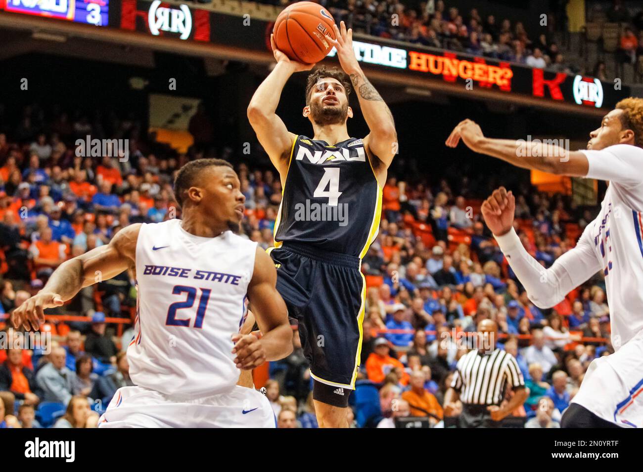 Northern Arizona's Kris Yanku (4) shoots over Boise State's Montigo ...