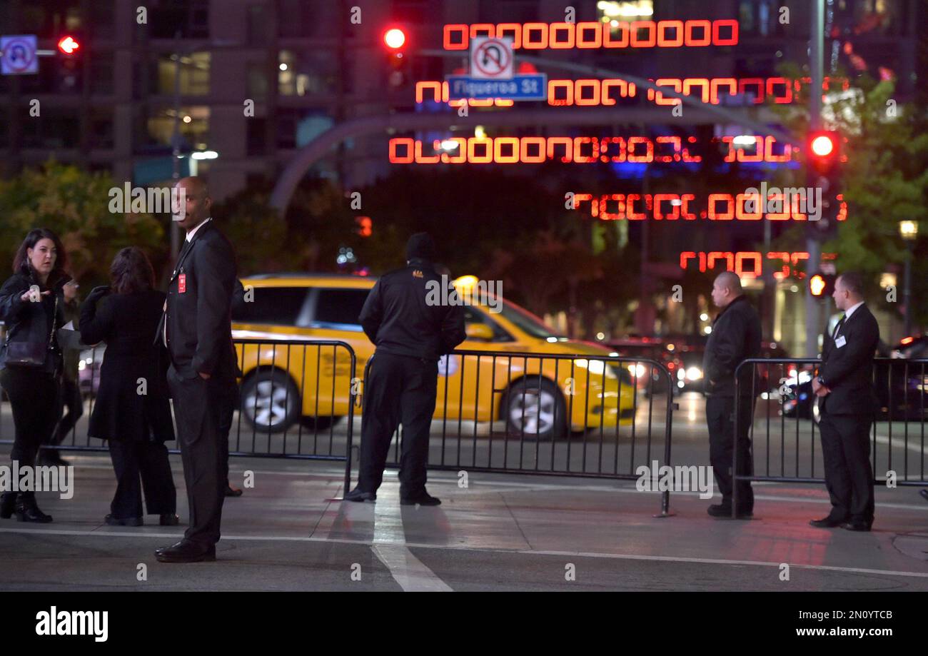 Security guards and staff monitor the red carpet at the Los Angeles ...