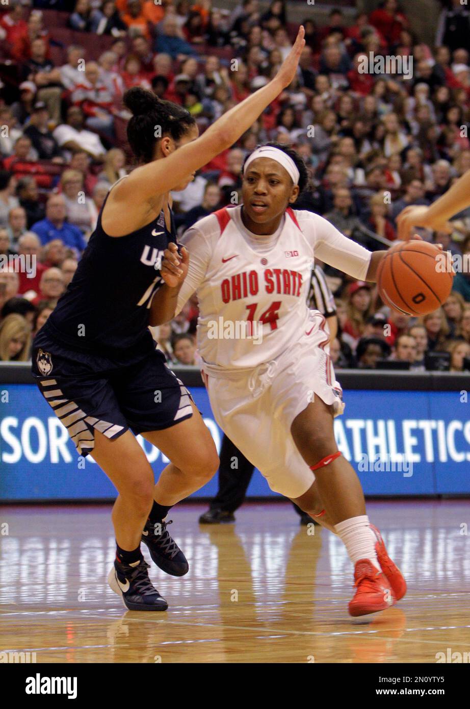 Ohio State's Ameryst Alston, right, drives the lane against Connecticut ...