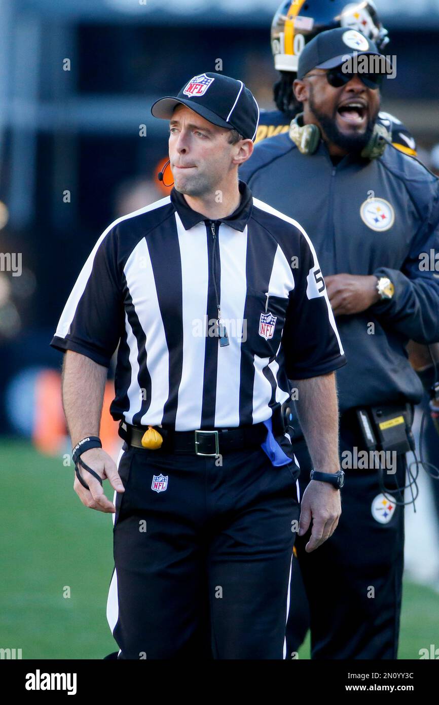 NFL Official, field judge Aaron Santi (50) works an NFL football game ...