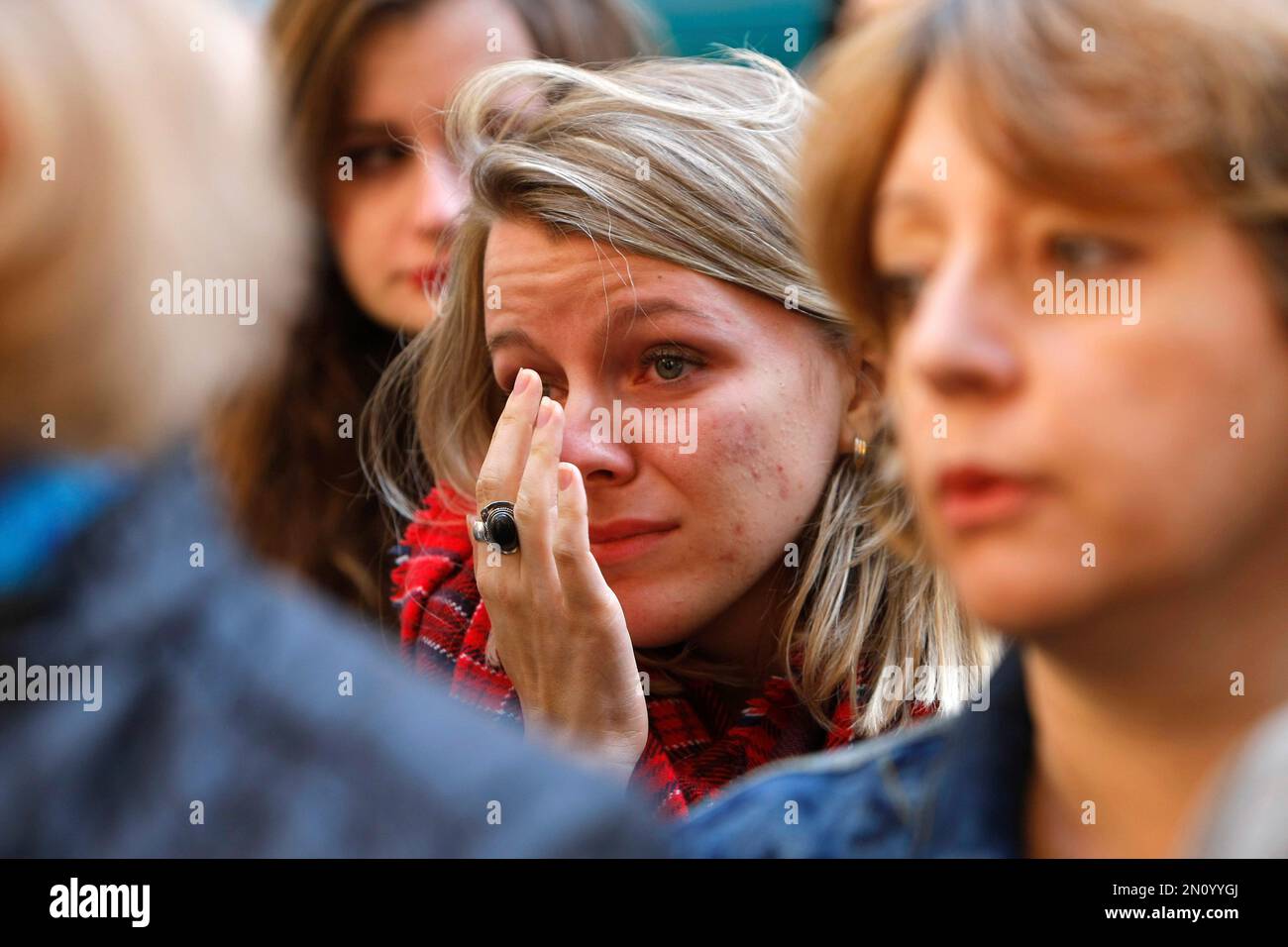 A woman cries during a minute of silence in Aix-en-Provence, southern ...