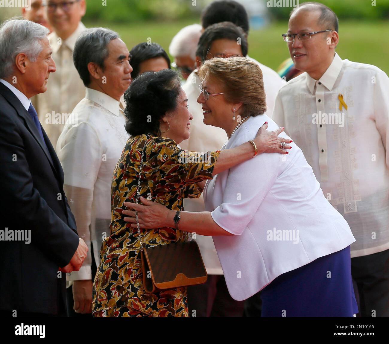 President Michelle Bachelet, right front, of Chile is greeted by ...